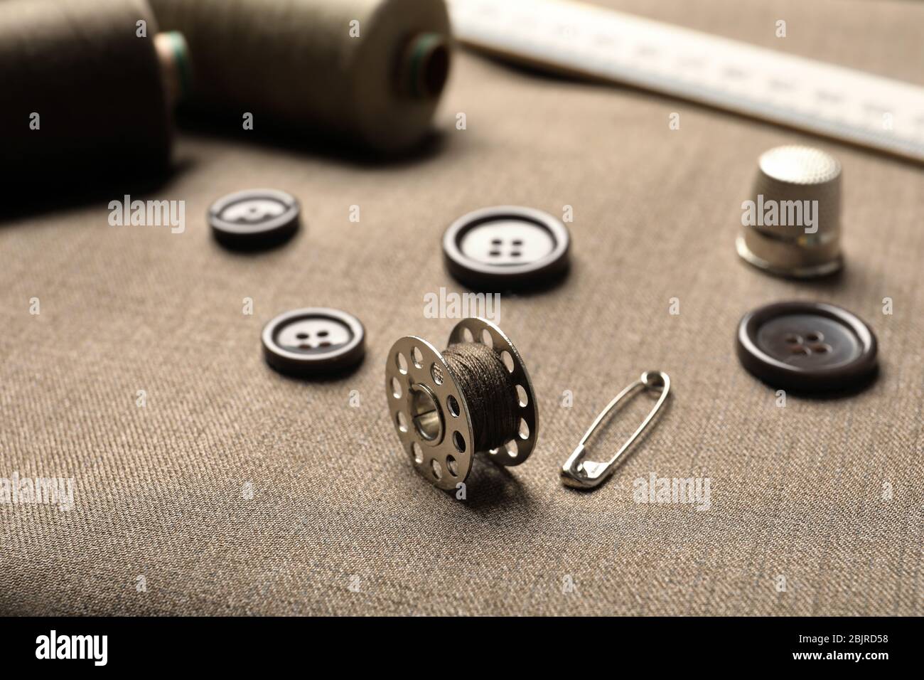 Accessories for tailoring on fabric Stock Photo - Alamy