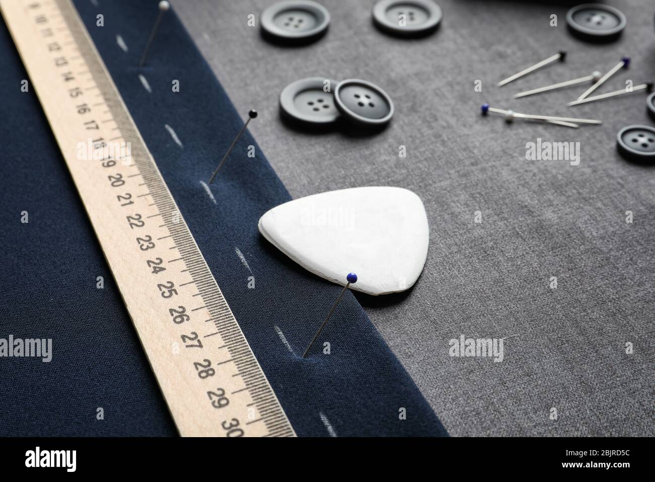 Accessories for tailoring on fabric Stock Photo - Alamy