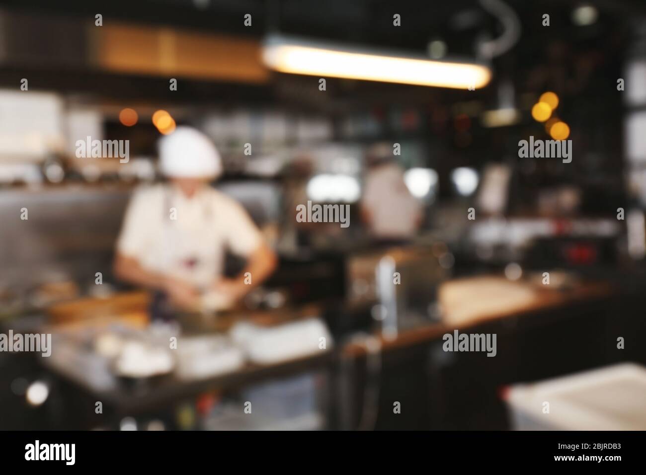 Blurred view of restaurant kitchen Stock Photo - Alamy