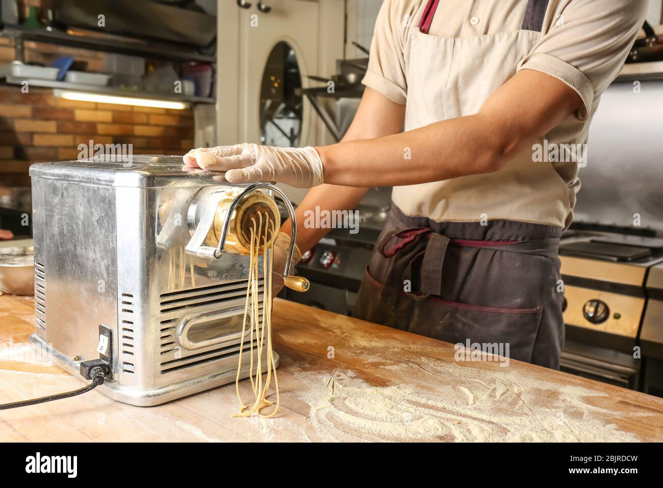 Male chef preparing pasta hi-res stock photography and images - Alamy