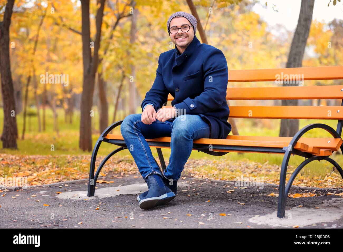Male model posing on bench hi-res stock photography and images - Alamy
