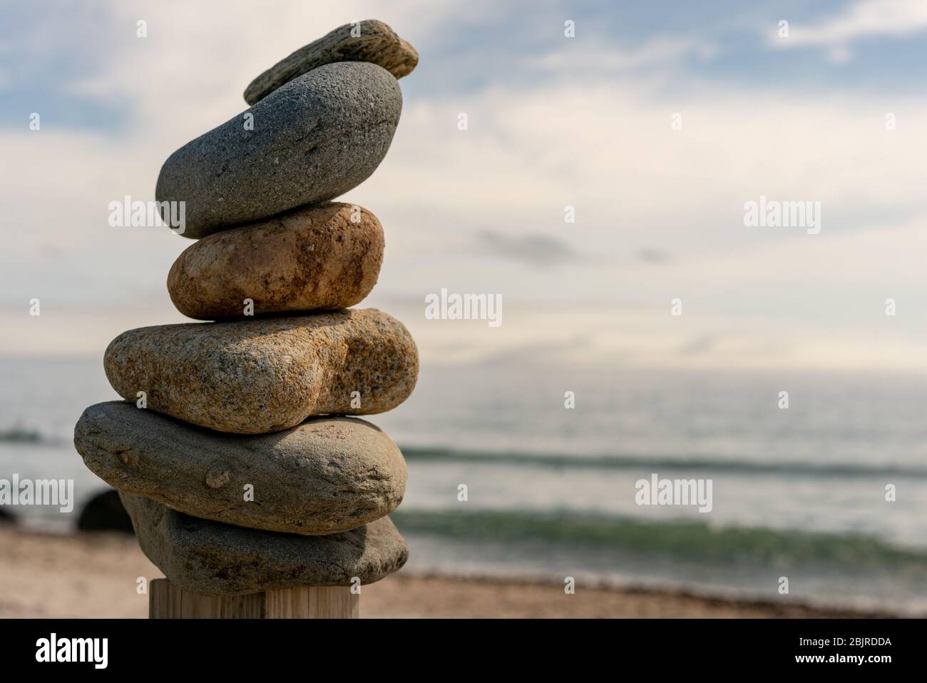 Rock cairn on a beach Stock Photo - Alamy