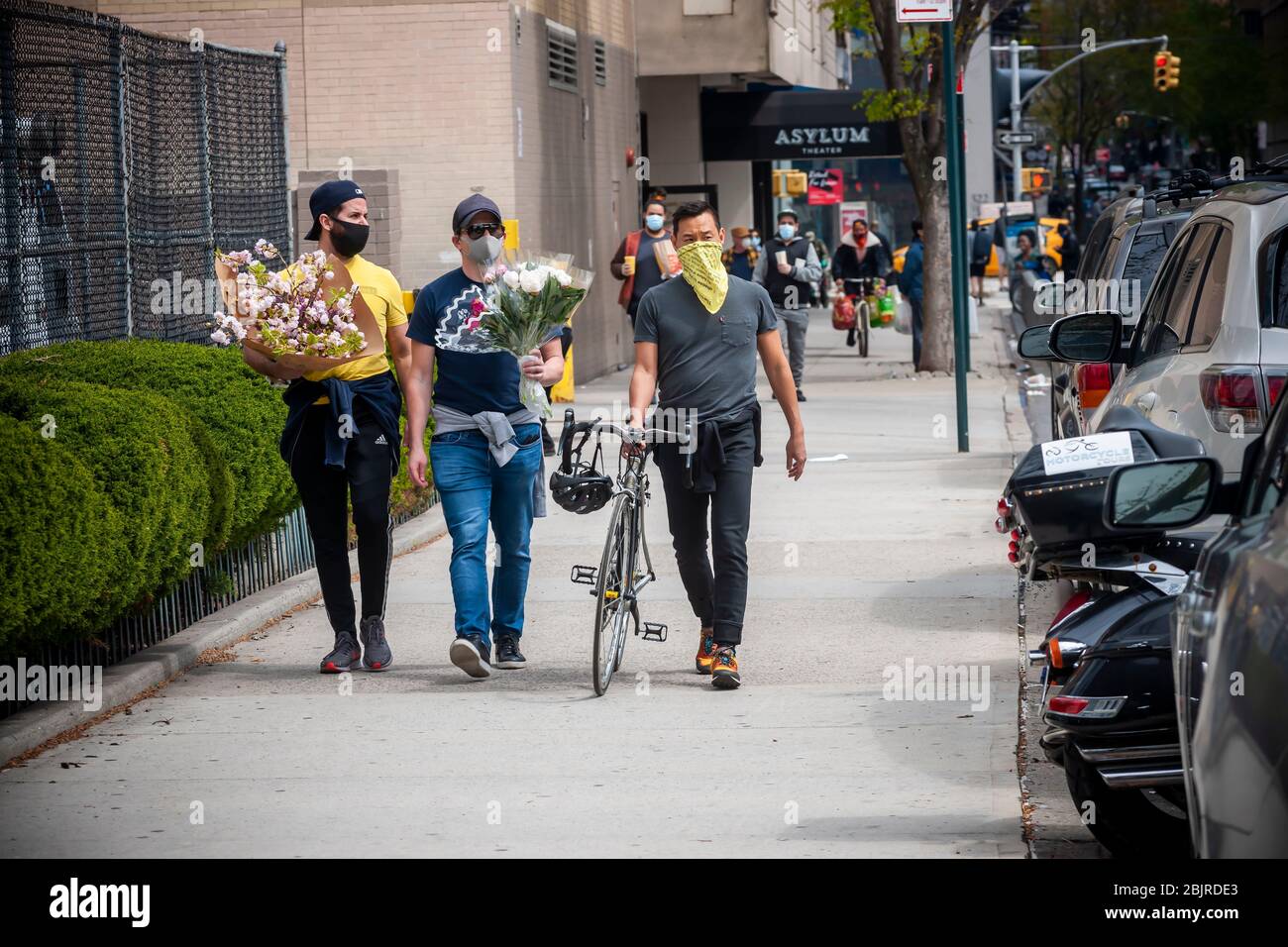 Masked men with flowers in New York during the COVID-19 pandemic on ...