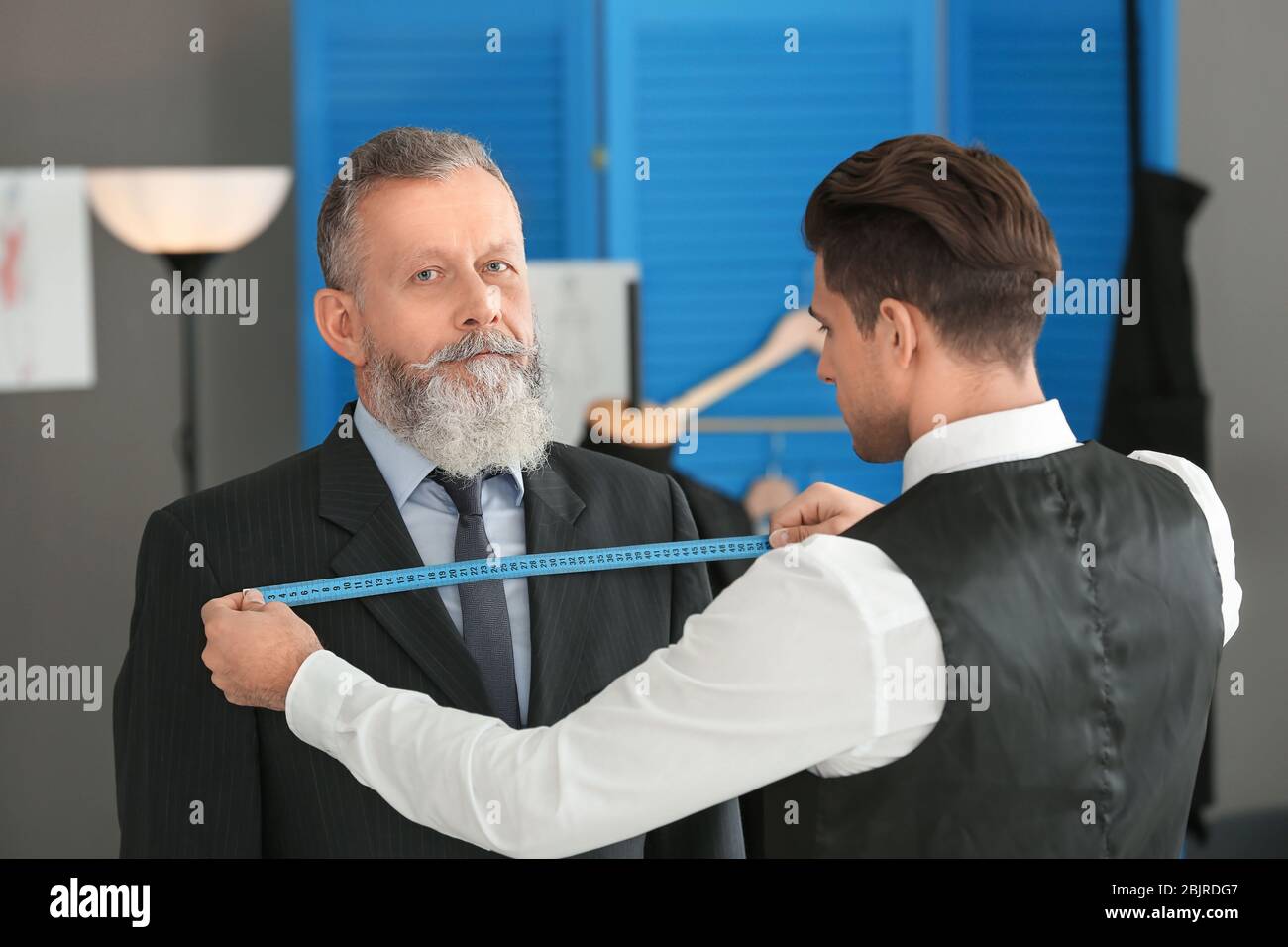Senior tailor taking clients hi-res stock photography and images - Alamy