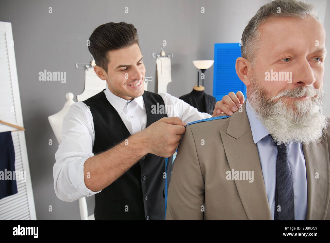 Senior tailor taking clients hi-res stock photography and images - Alamy