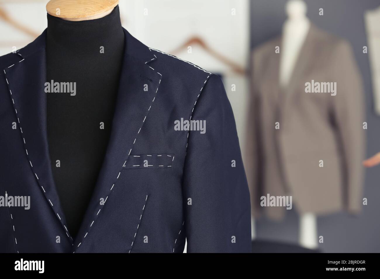 Tailor's mannequin with half-made jacket in atelier Stock Photo - Alamy