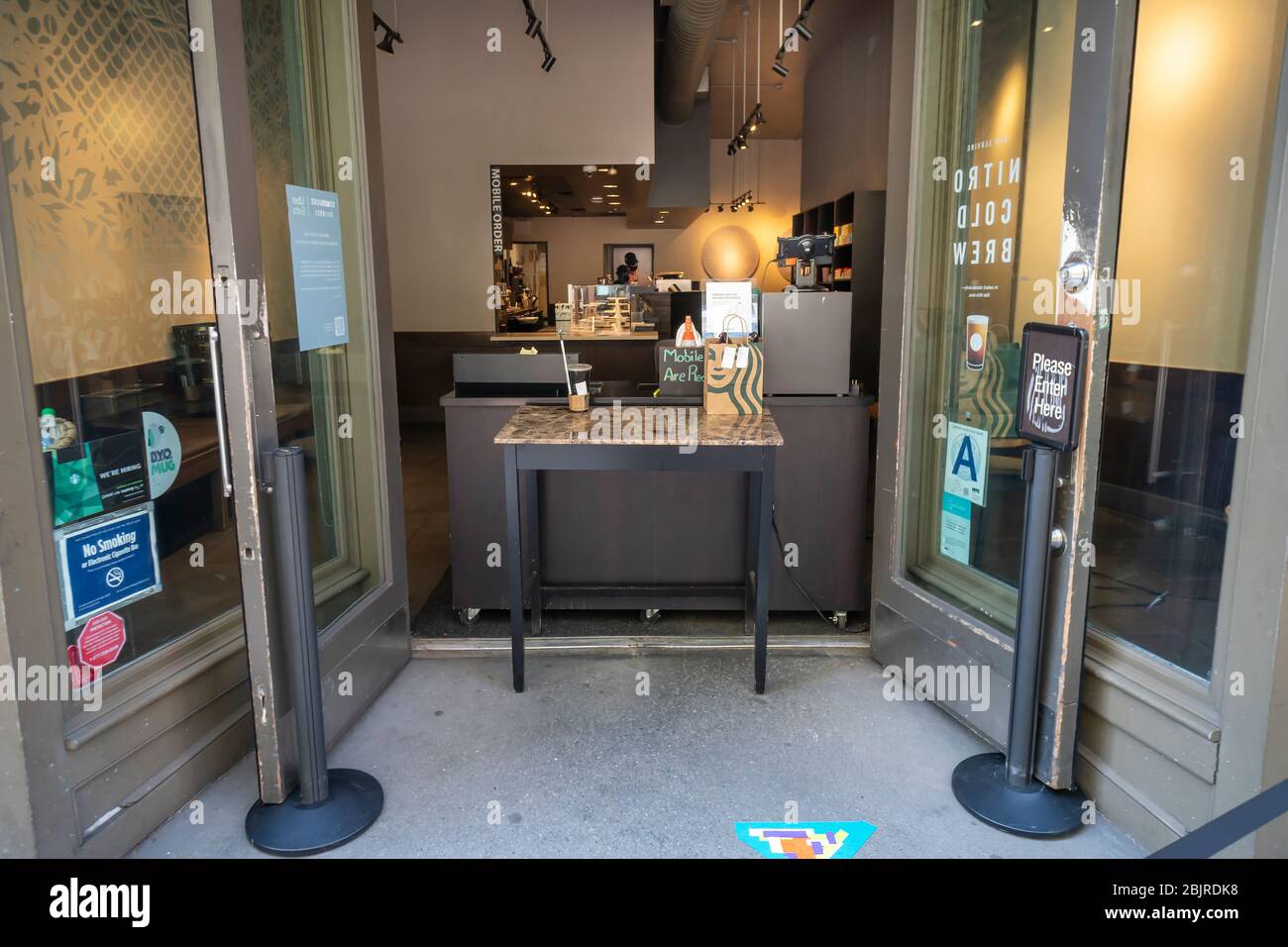 A Starbucks Coffee opens for contact-less pick-up in Chelsea in New ...