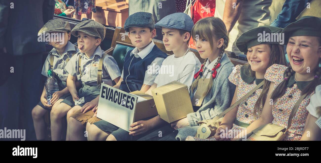 Retro, vintage front view of 1940s evacuees, ww2 children waiting at ...