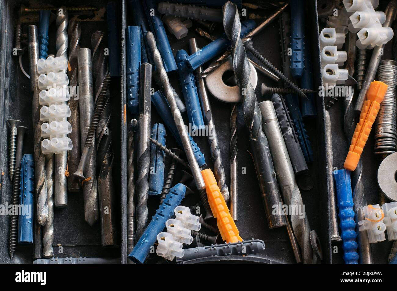 Set of tools and different contraptions in a plastic box Stock Photo ...