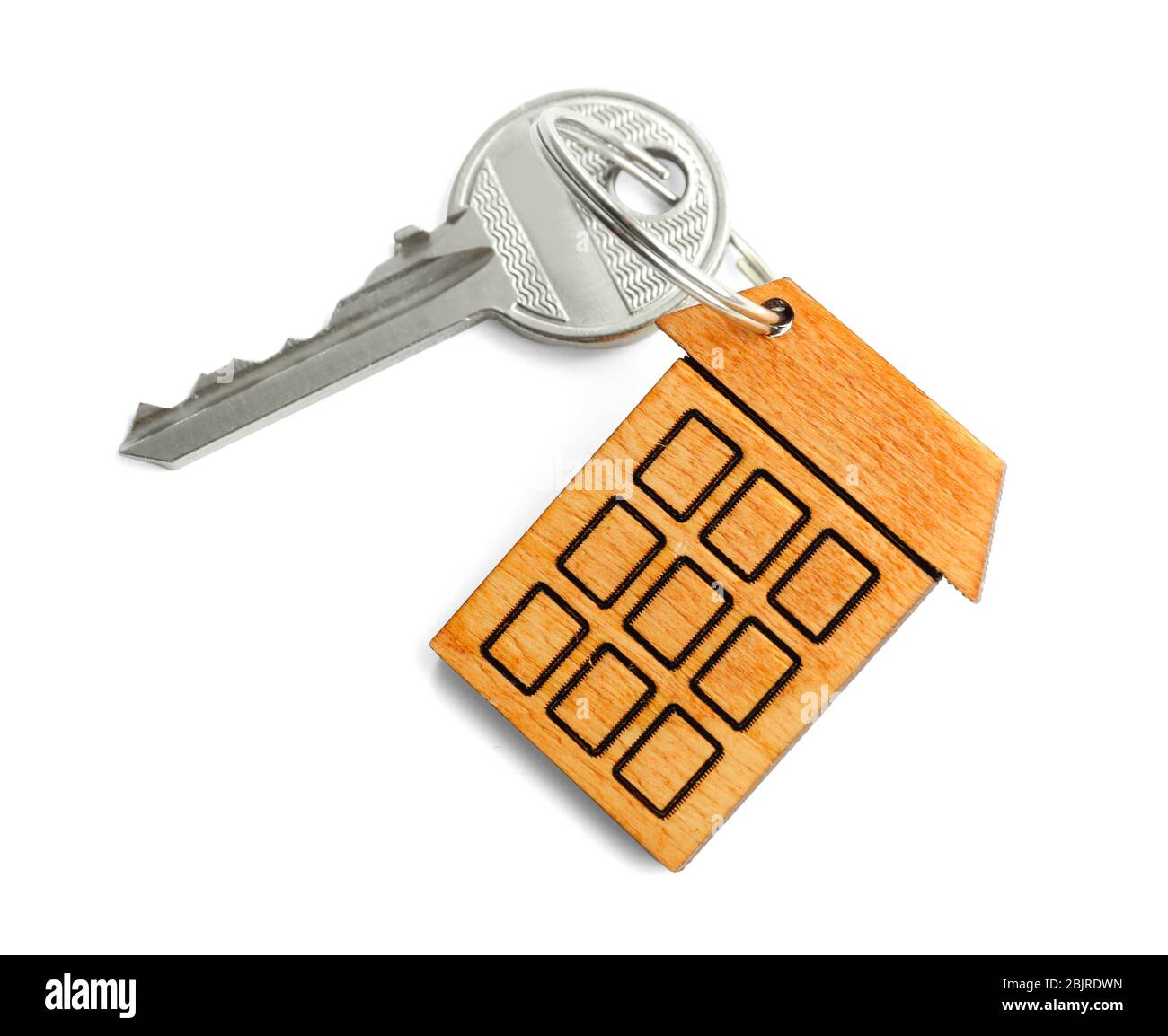 Key with trinket in shape of house on white background Stock Photo - Alamy