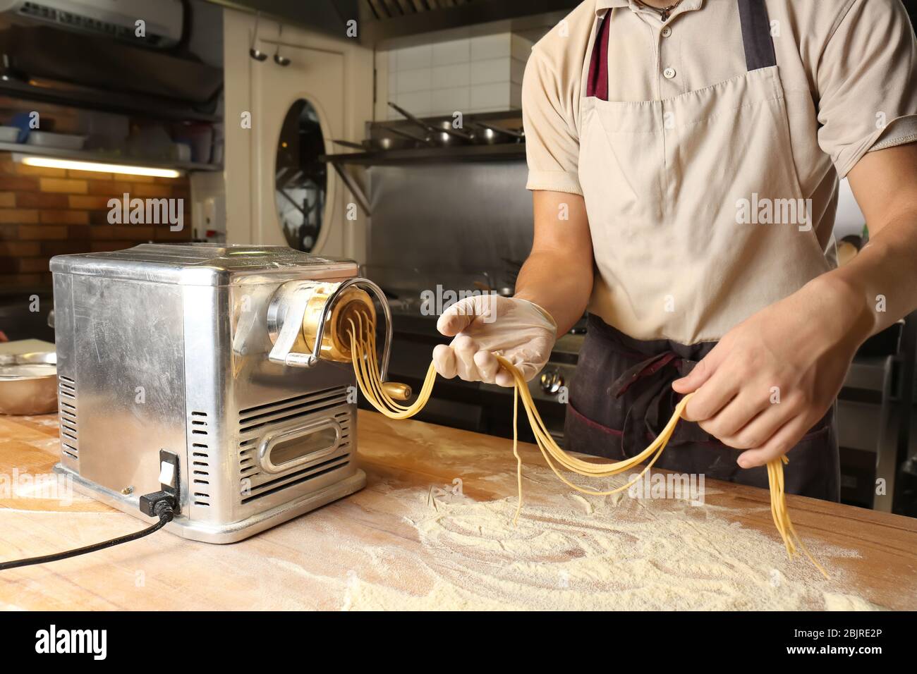 Male chef preparing pasta hi-res stock photography and images - Alamy