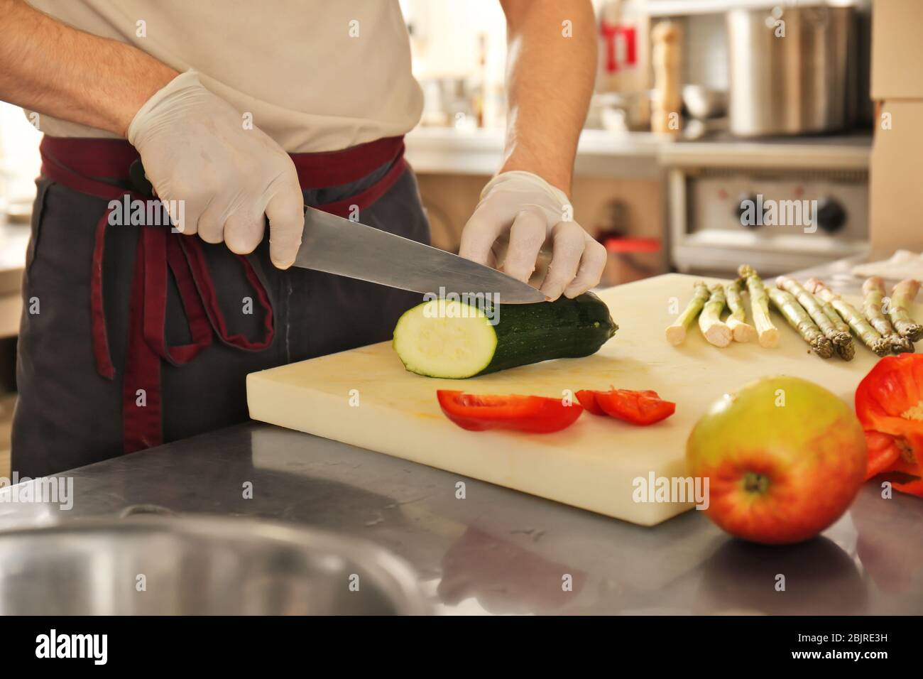 Professional chef cutting zucchini hi-res stock photography and images ...