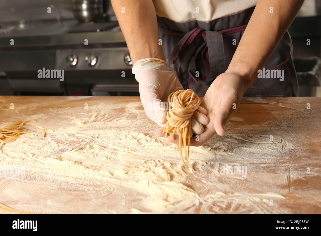 Male chef preparing pasta hi-res stock photography and images - Alamy