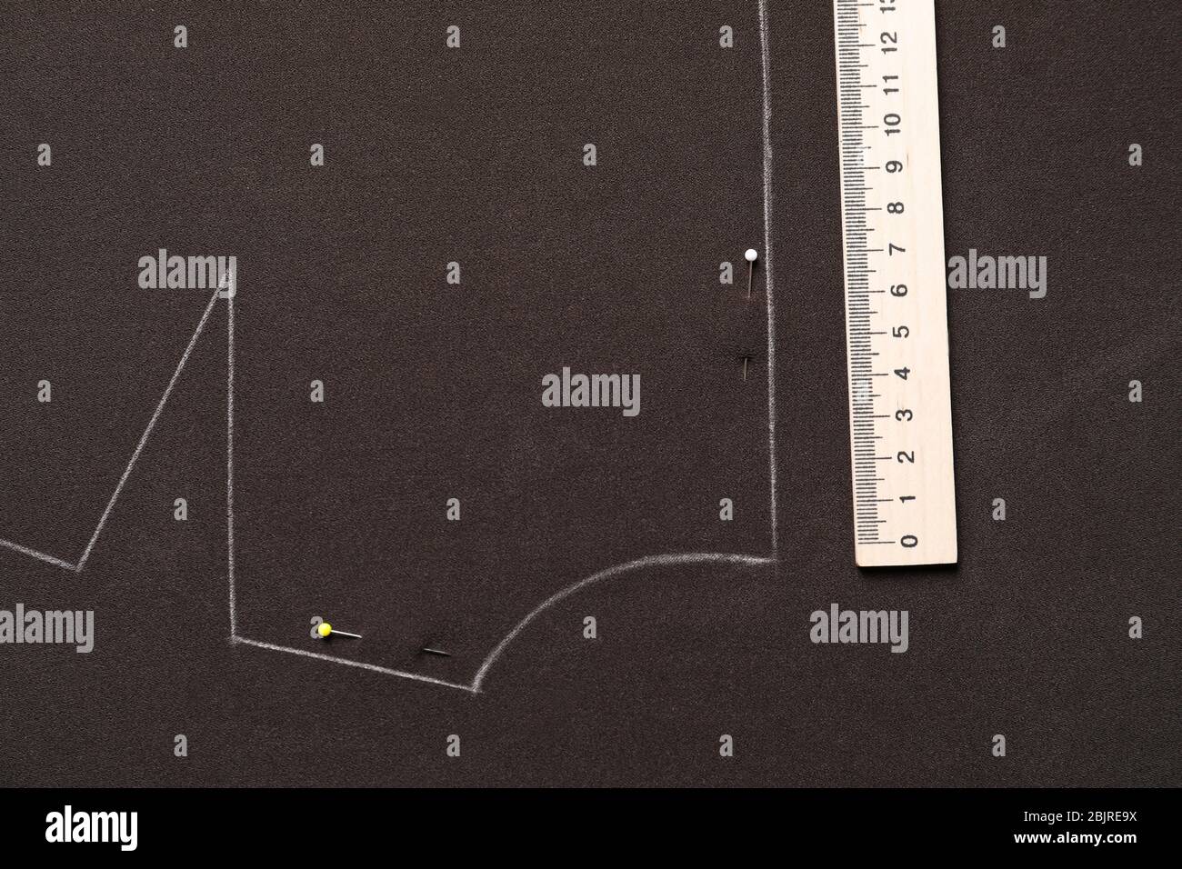 Fabric with pattern template and ruler, closeup Stock Photo - Alamy