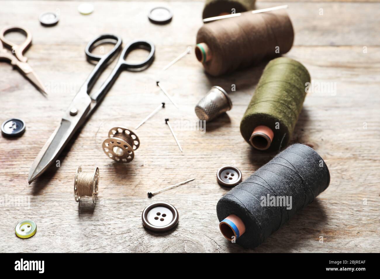 Set of tailoring tools and accessories on table, closeup Stock Photo ...