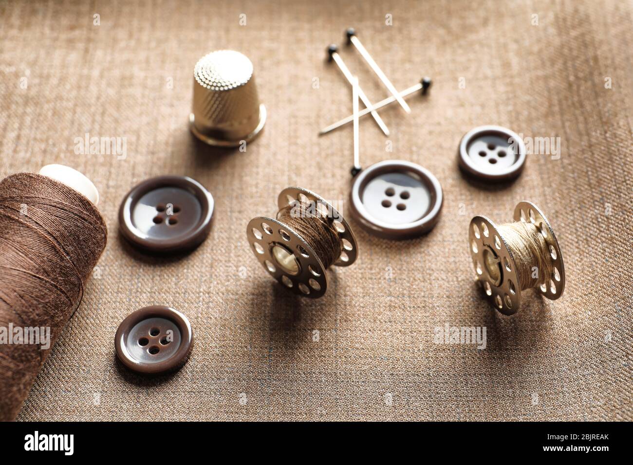 Set of tailoring tools and accessories on fabric, closeup Stock Photo ...