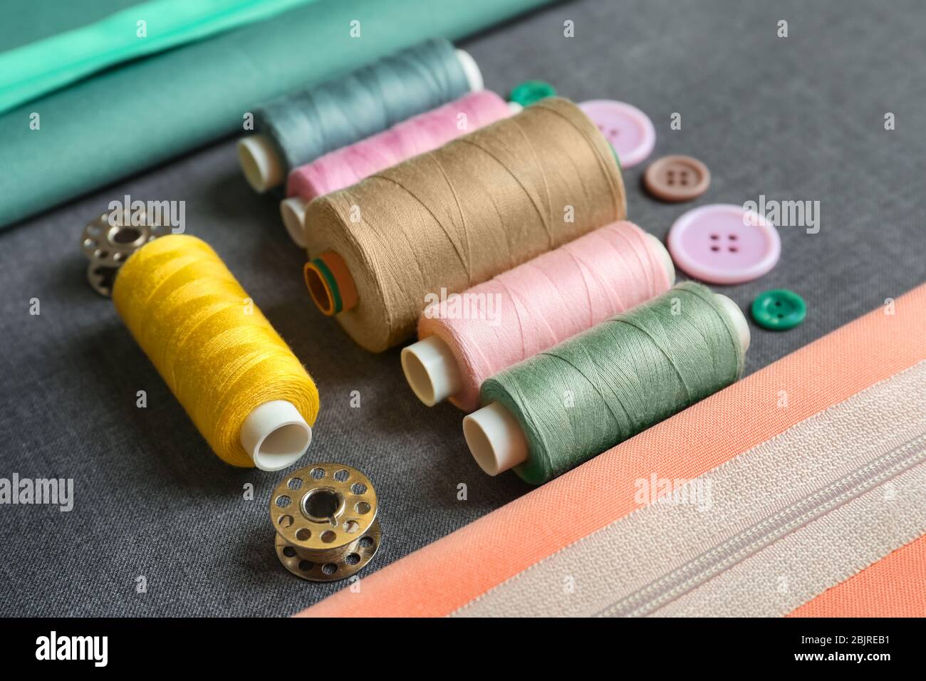 Set of tailoring tools and accessories on fabric, closeup Stock Photo ...