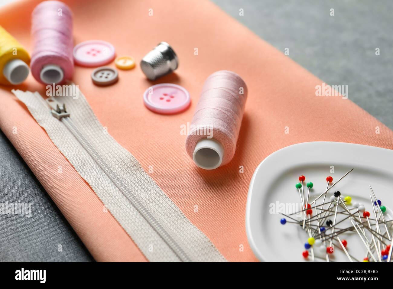 Set of tailoring items on fabric, closeup Stock Photo - Alamy