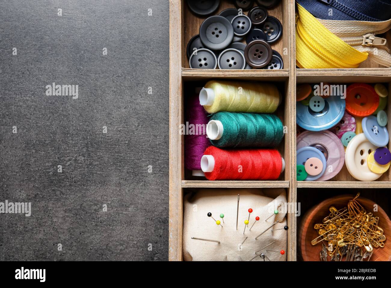 Storage box with set of tailoring items on table, top view Stock Photo ...