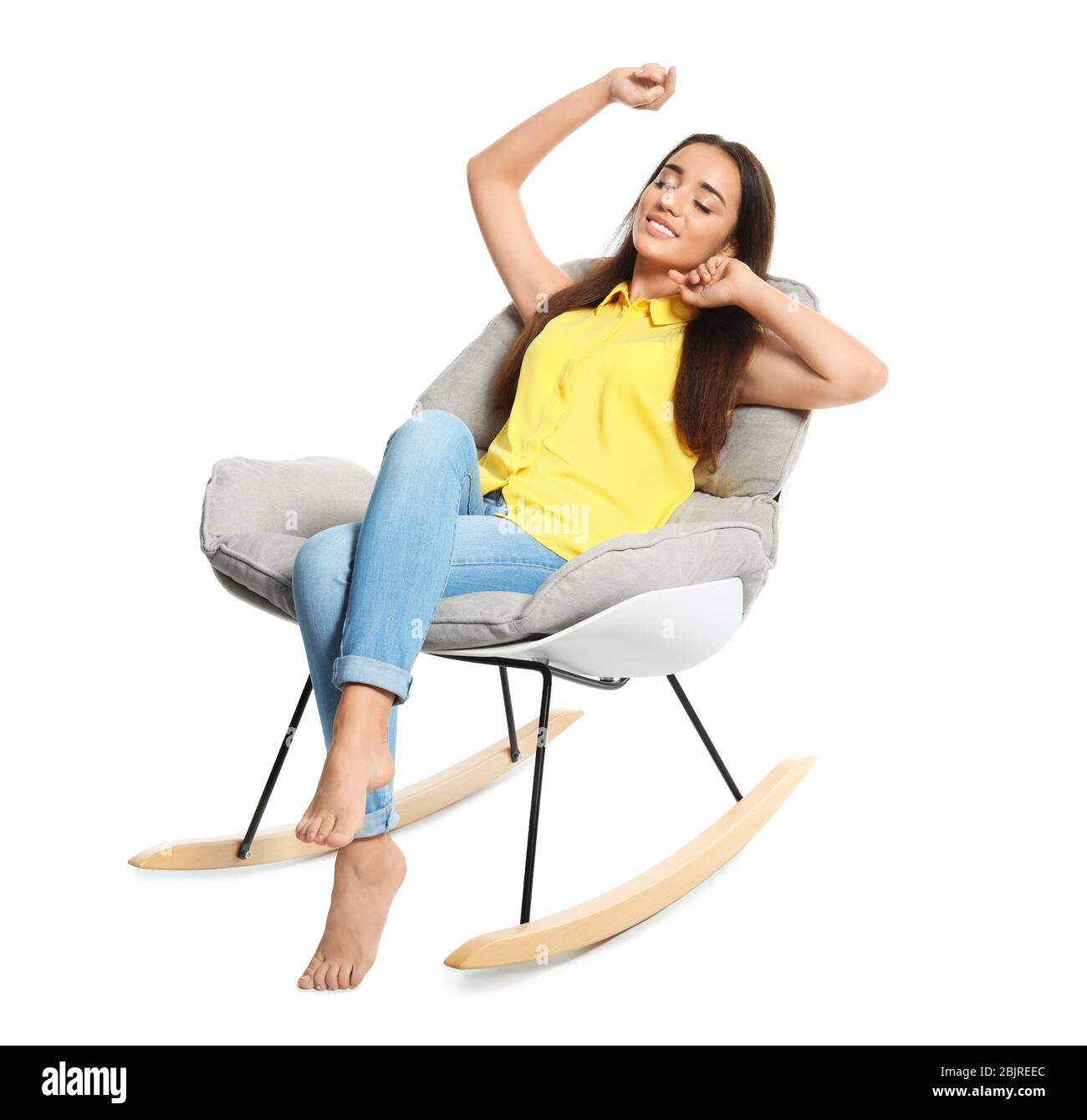 Young woman resting in rocking chair on white background Stock Photo ...