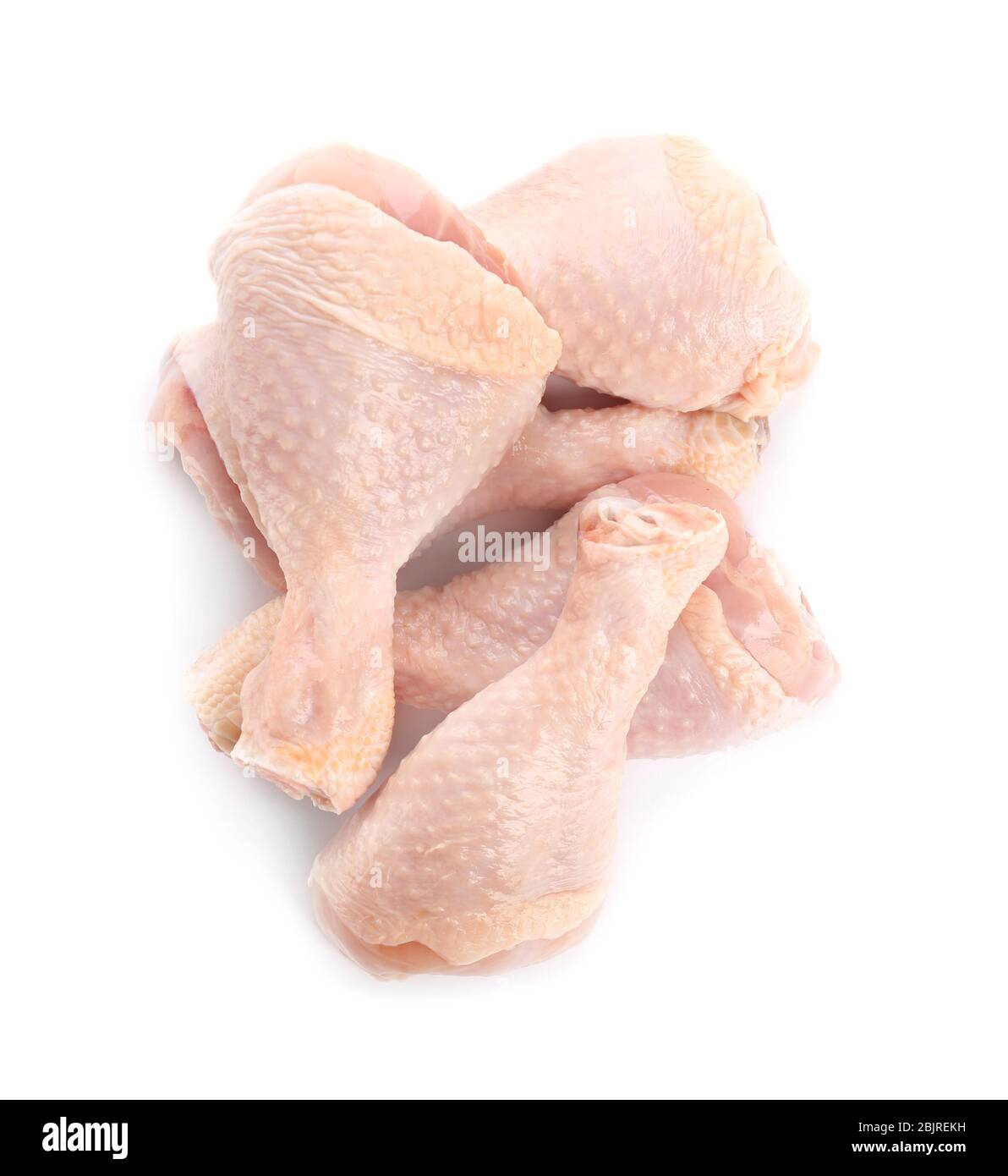 Raw chicken legs on white background Stock Photo - Alamy
