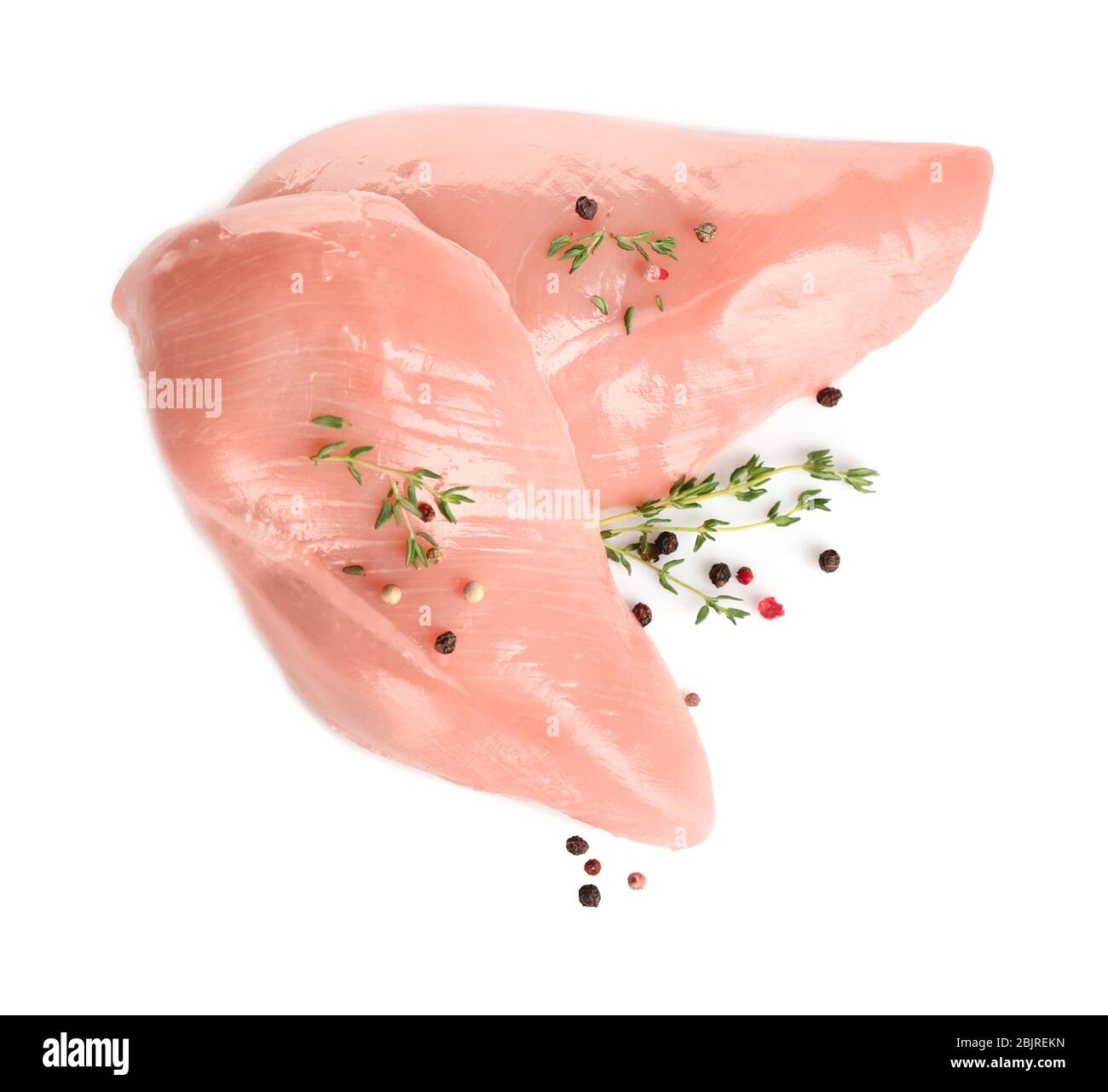 Raw chicken fillet with pepper grains on white background Stock Photo ...