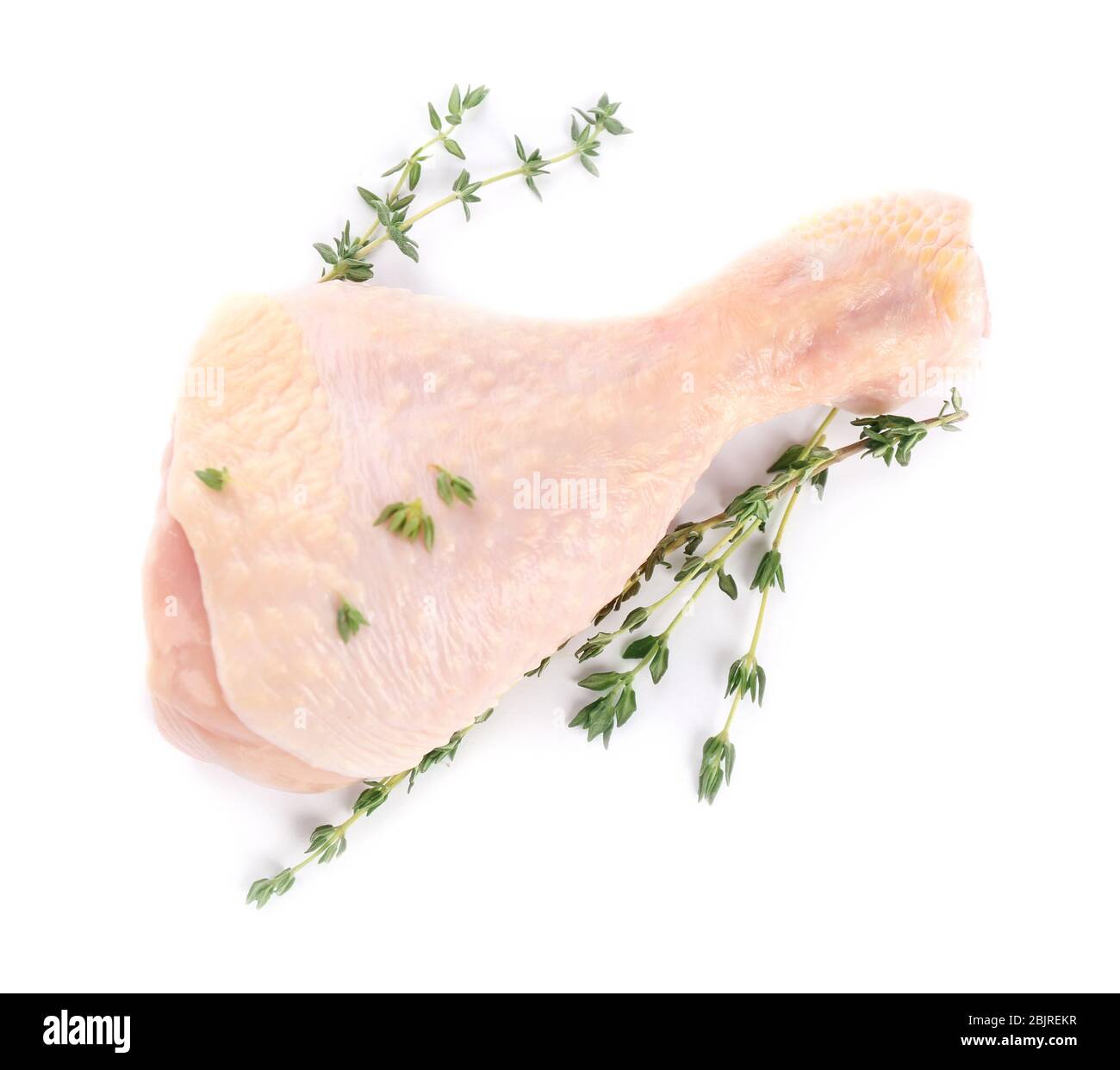 Raw chicken leg on white background Stock Photo - Alamy