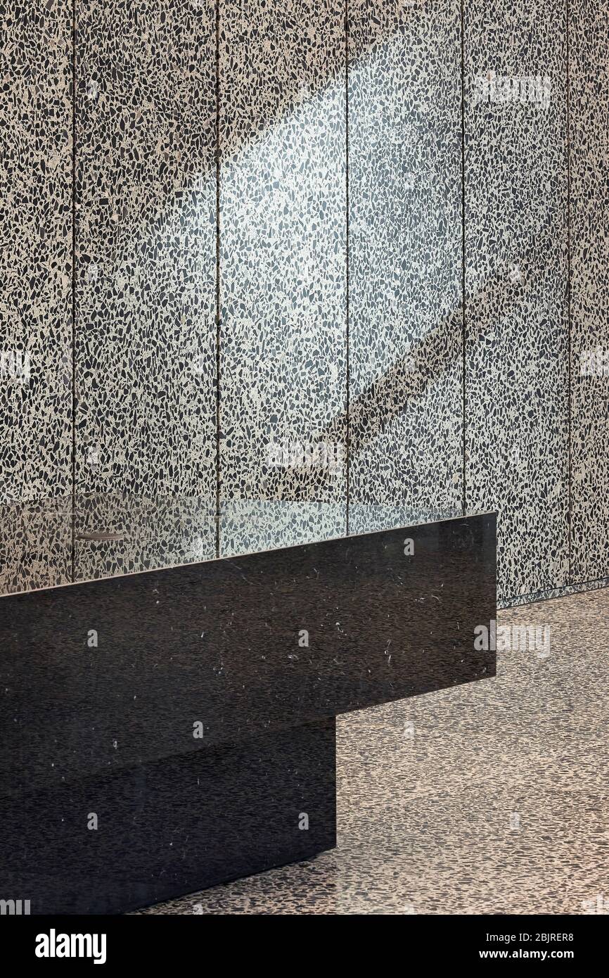 Granite bench in reception area. 25 Cabot Square, London, United ...