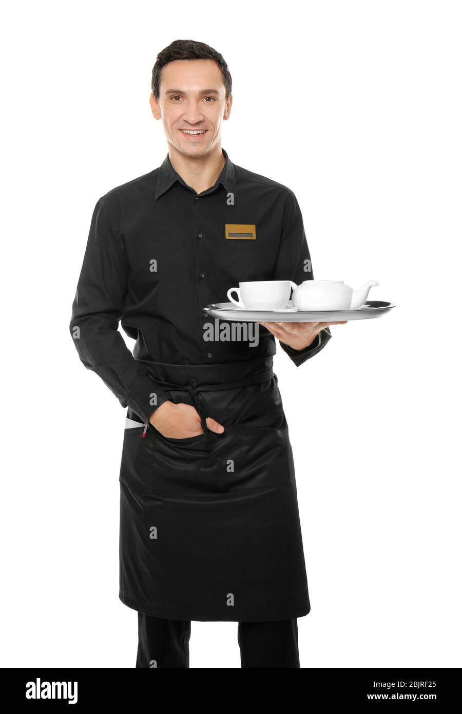 Waiter holding tray with tea set on white background Stock Photo - Alamy