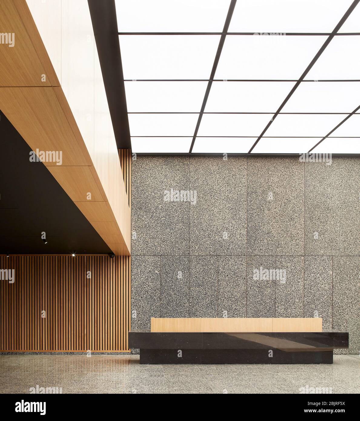 Corporate reception space with desk and illuminated ceiling. 25 Cabot ...