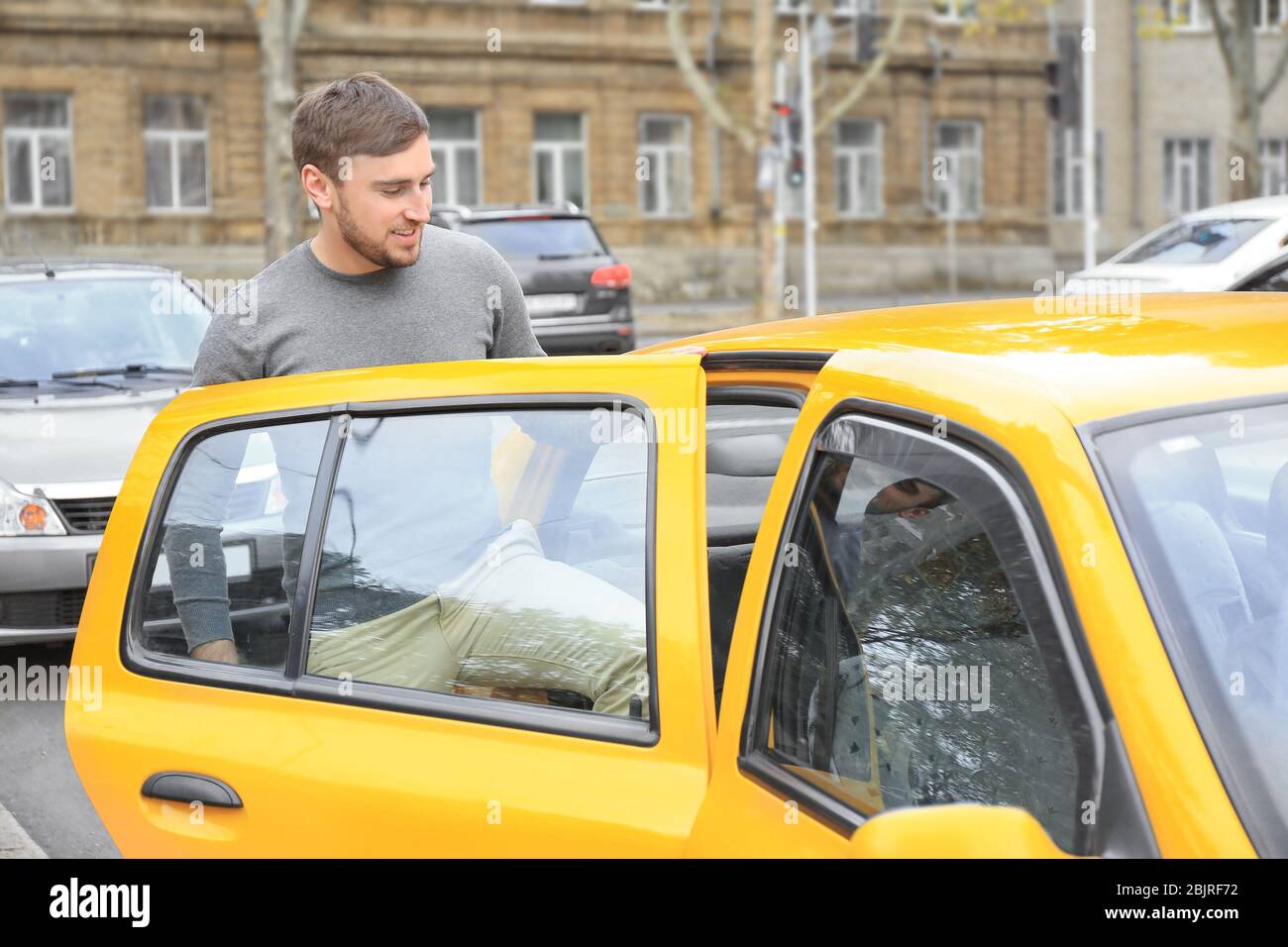 Getting into taxi hi-res stock photography and images - Alamy