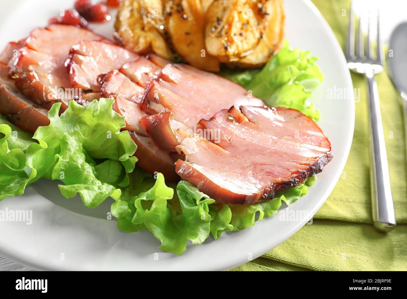 Plate with sliced honey baked ham, closeup Stock Photo - Alamy