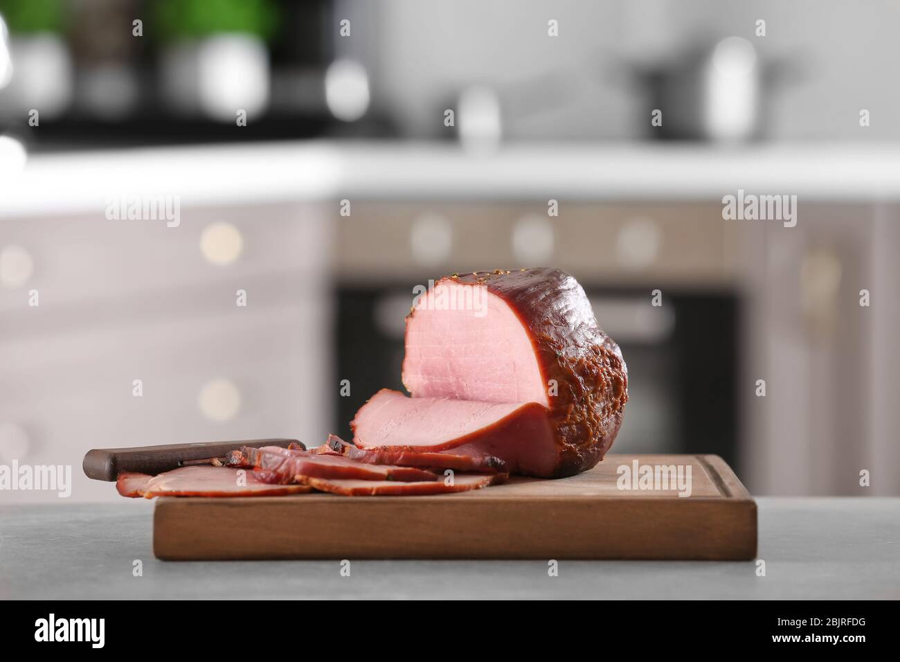 Delicious sliced honey baked ham on table Stock Photo - Alamy