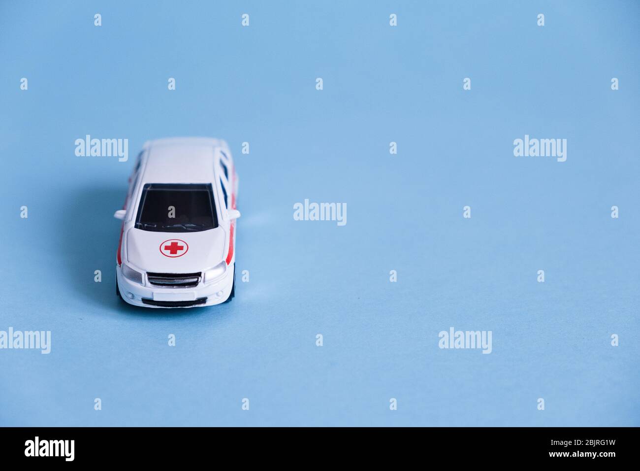 Ambulance Car on blue background. An emergency medical service. Toy ...