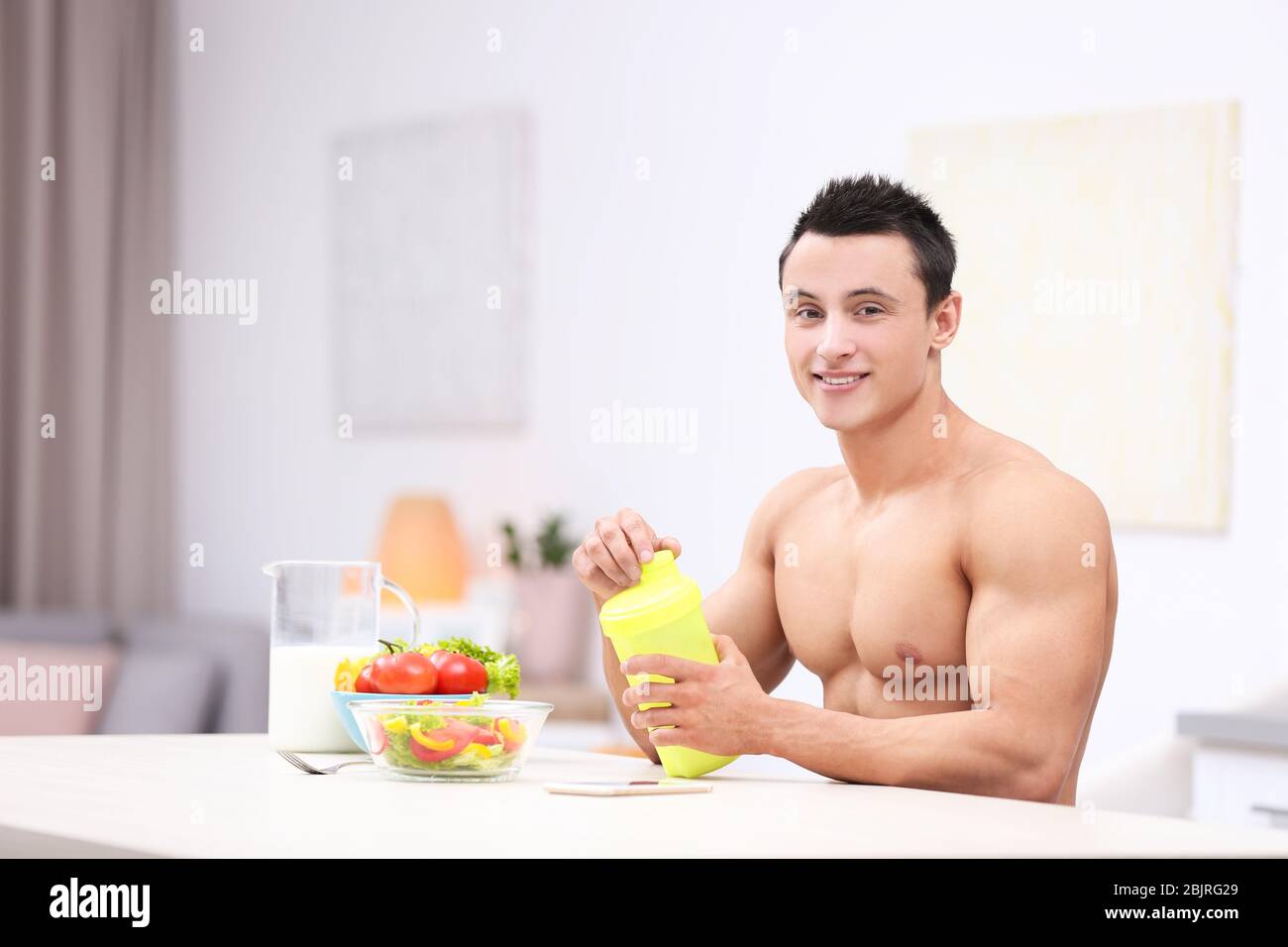 Man eating vegetable muscular hi-res stock photography and images - Alamy