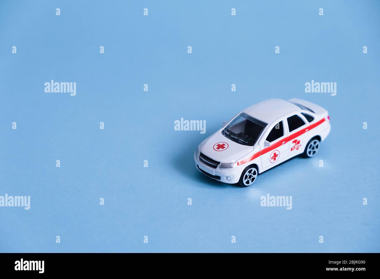 Ambulance Car on blue background. An emergency medical service. Toy ...