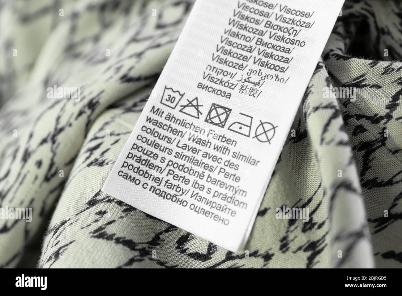 Clothing label with laundry instructions, closeup Stock Photo - Alamy