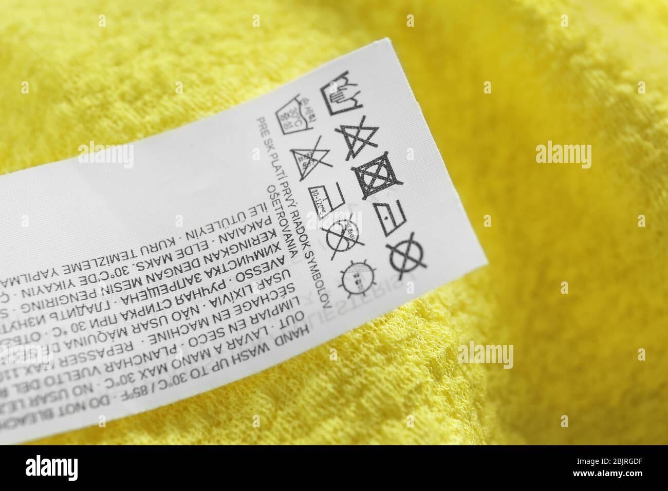 Clothing label with laundry instructions, closeup Stock Photo - Alamy