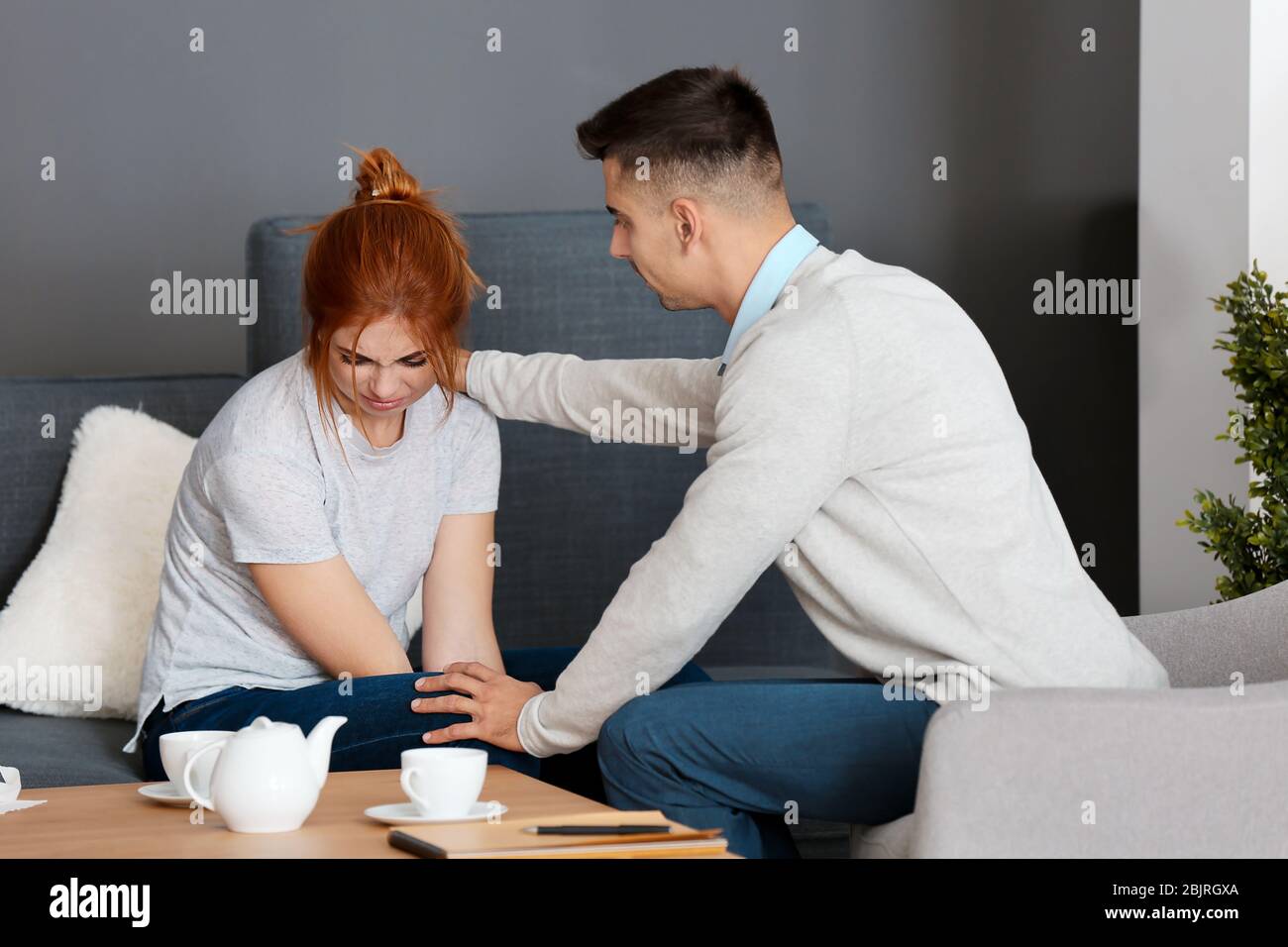 Male psychologist with client in office Stock Photo - Alamy