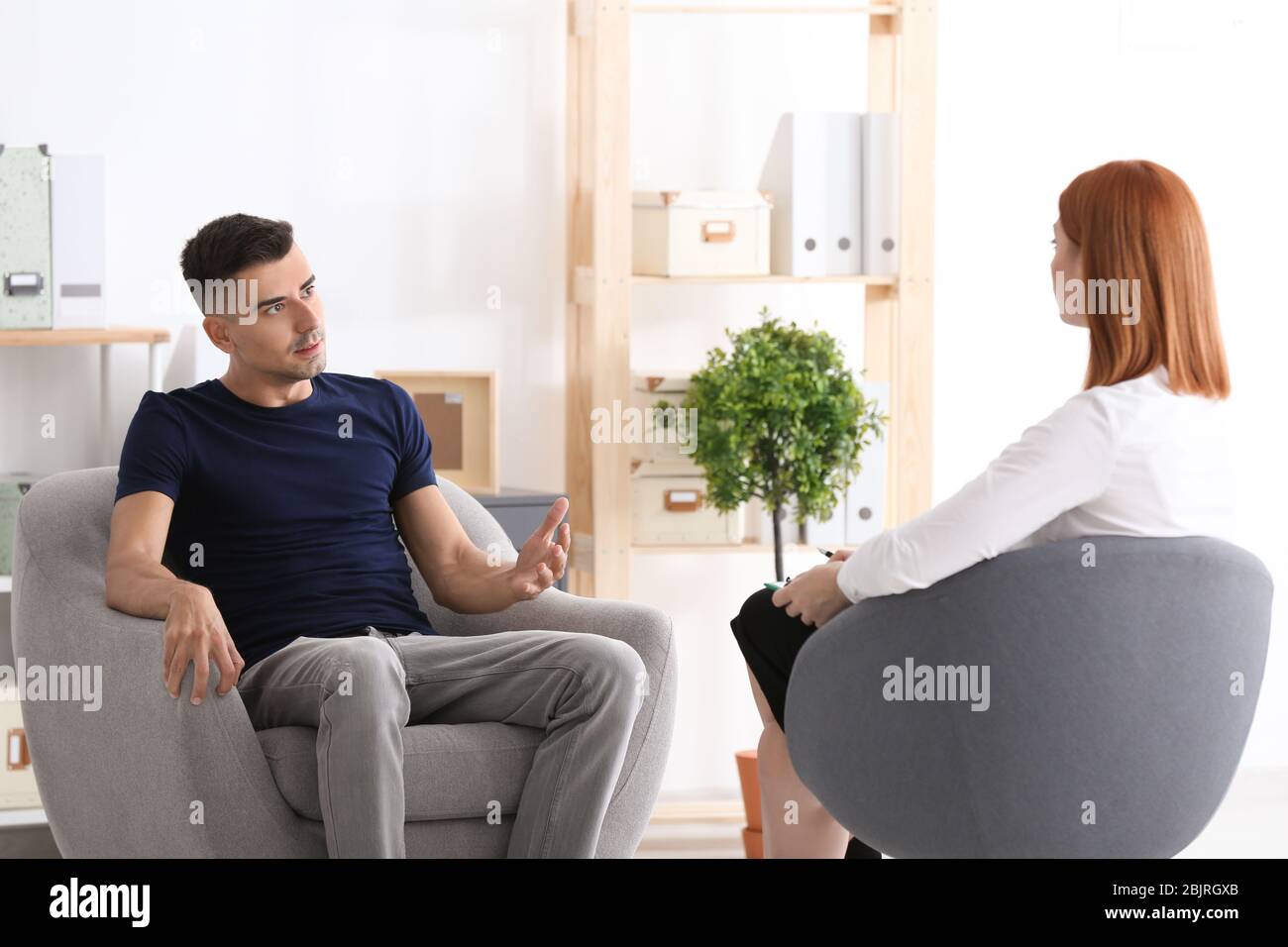 Female psychologist with client in office Stock Photo - Alamy