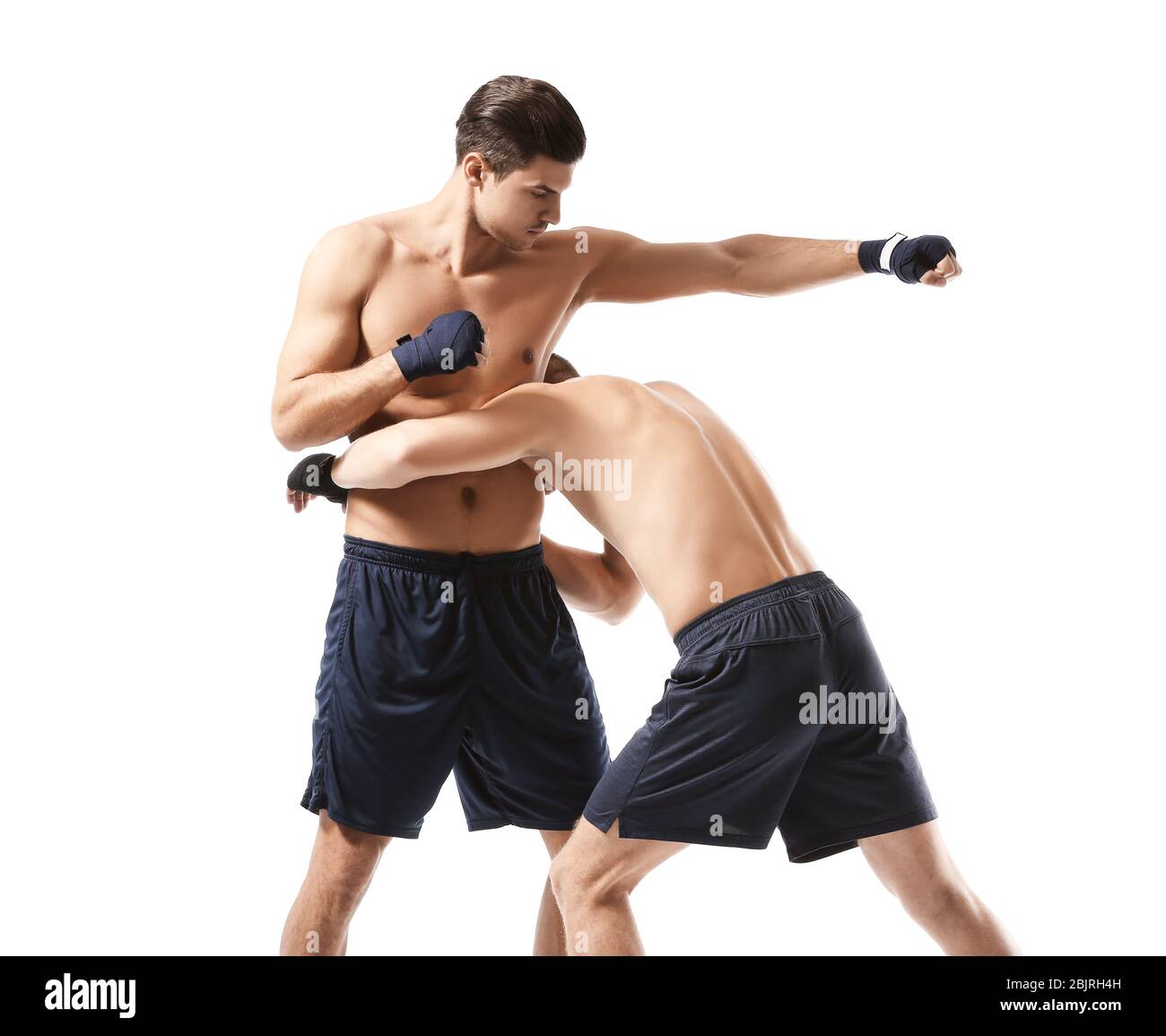 Attractive young boxers fighting on white background Stock Photo - Alamy