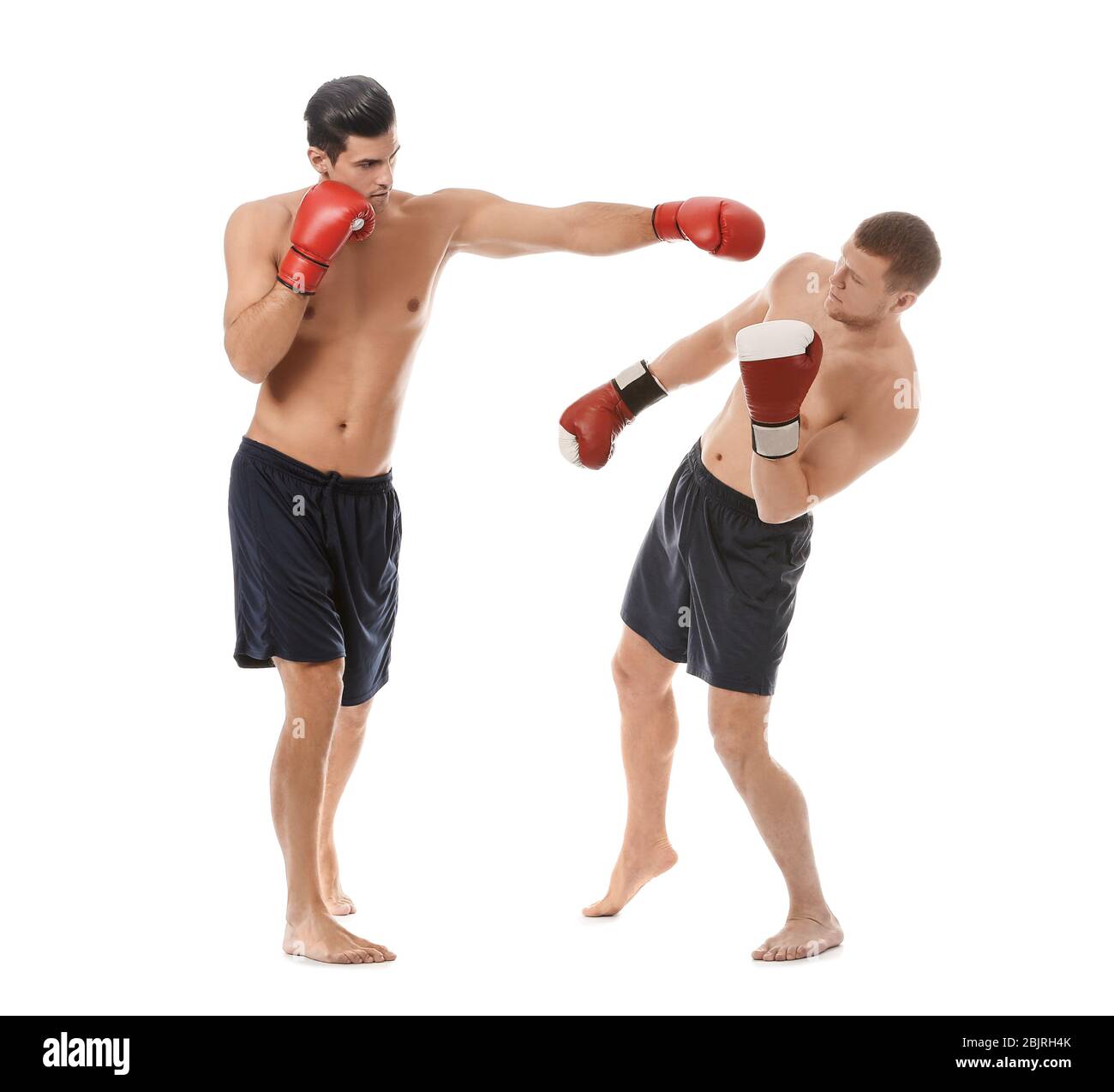 Attractive young boxers fighting on white background Stock Photo - Alamy