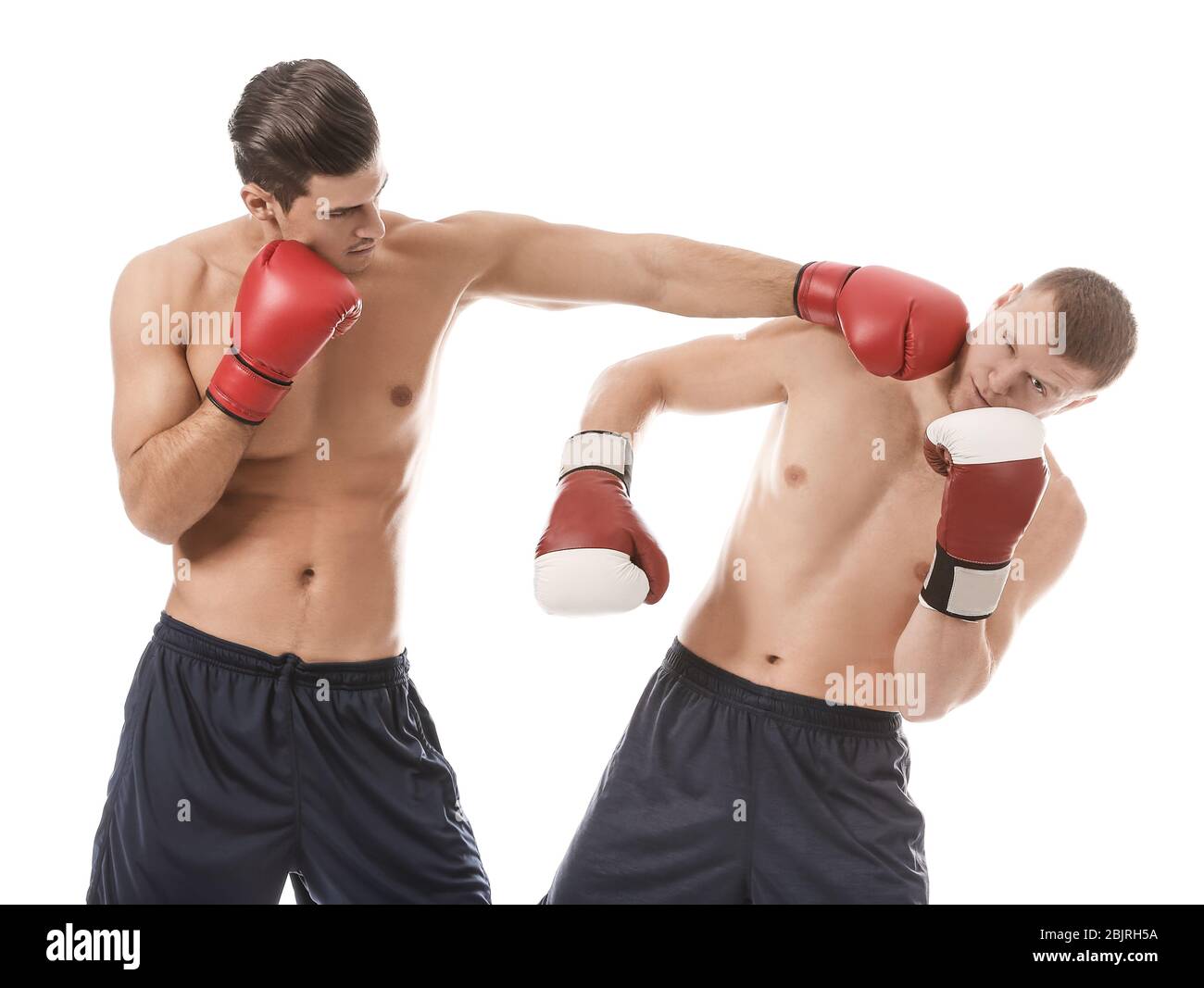 Attractive young boxers fighting on white background Stock Photo - Alamy