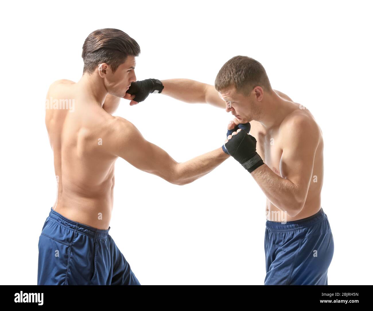 Attractive young boxers fighting on white background Stock Photo - Alamy