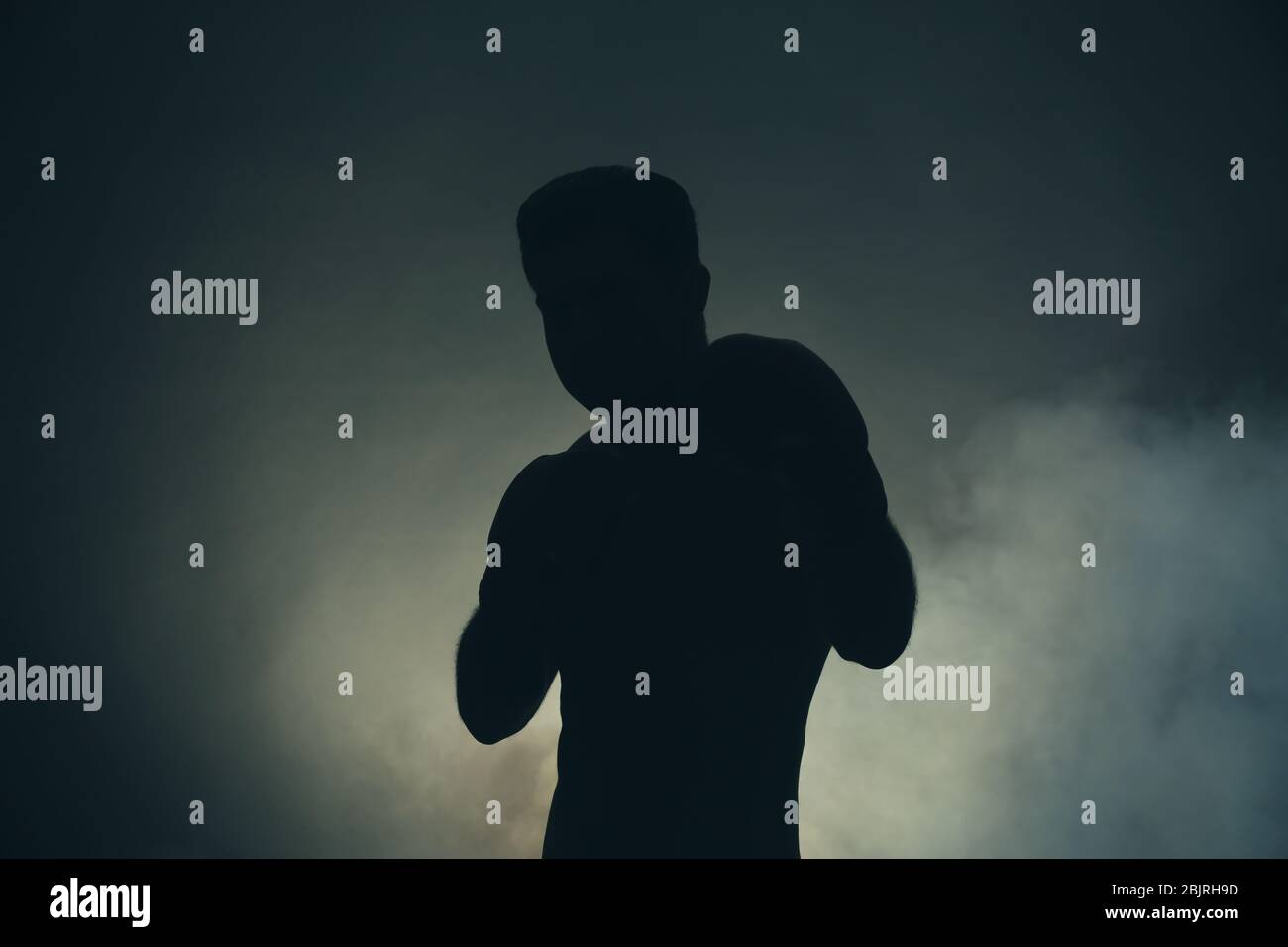 Silhouette of strong male boxer on dark background Stock Photo - Alamy