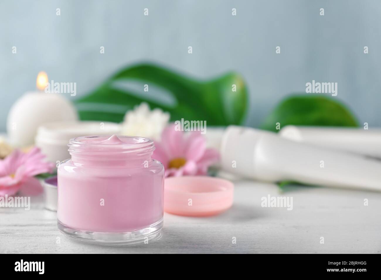 Jar with body cream on table Stock Photo - Alamy