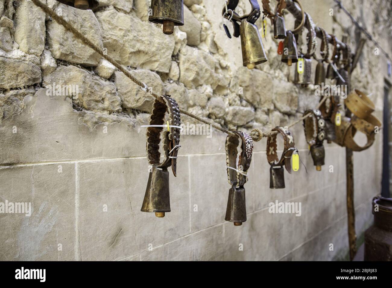 Metal cow bells, detail of farm objects Stock Photo - Alamy