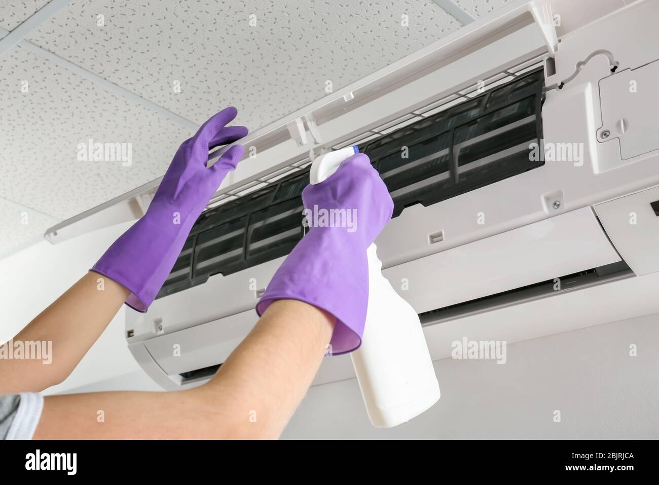 Woman cleaning ventilation fan hi-res stock photography and images - Alamy