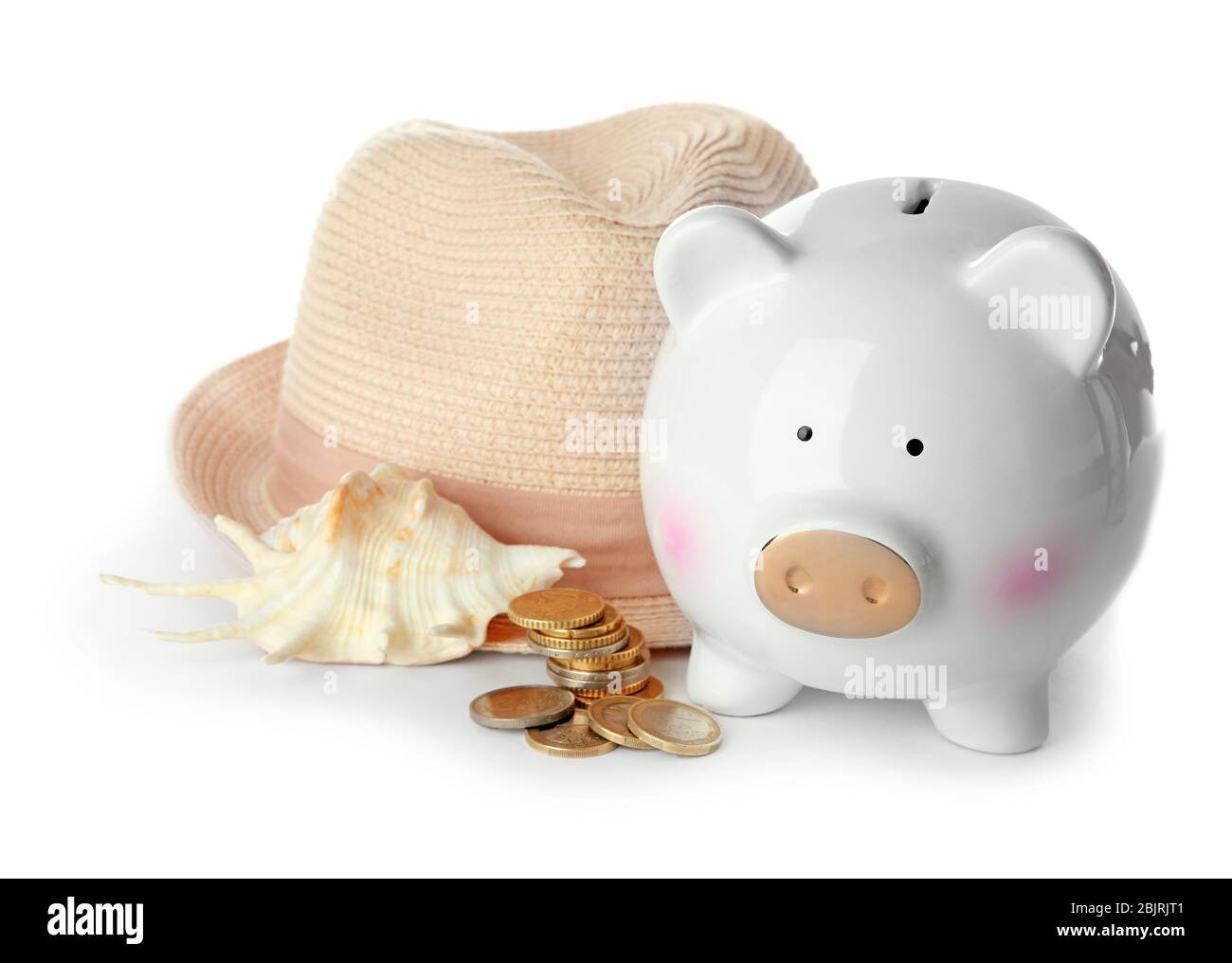 Ceramic piggy bank with money, shell and hat on white background Stock ...