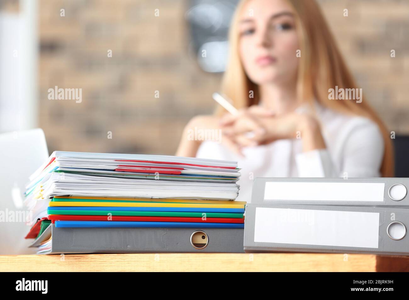 Woman stack papers on table hi-res stock photography and images - Alamy